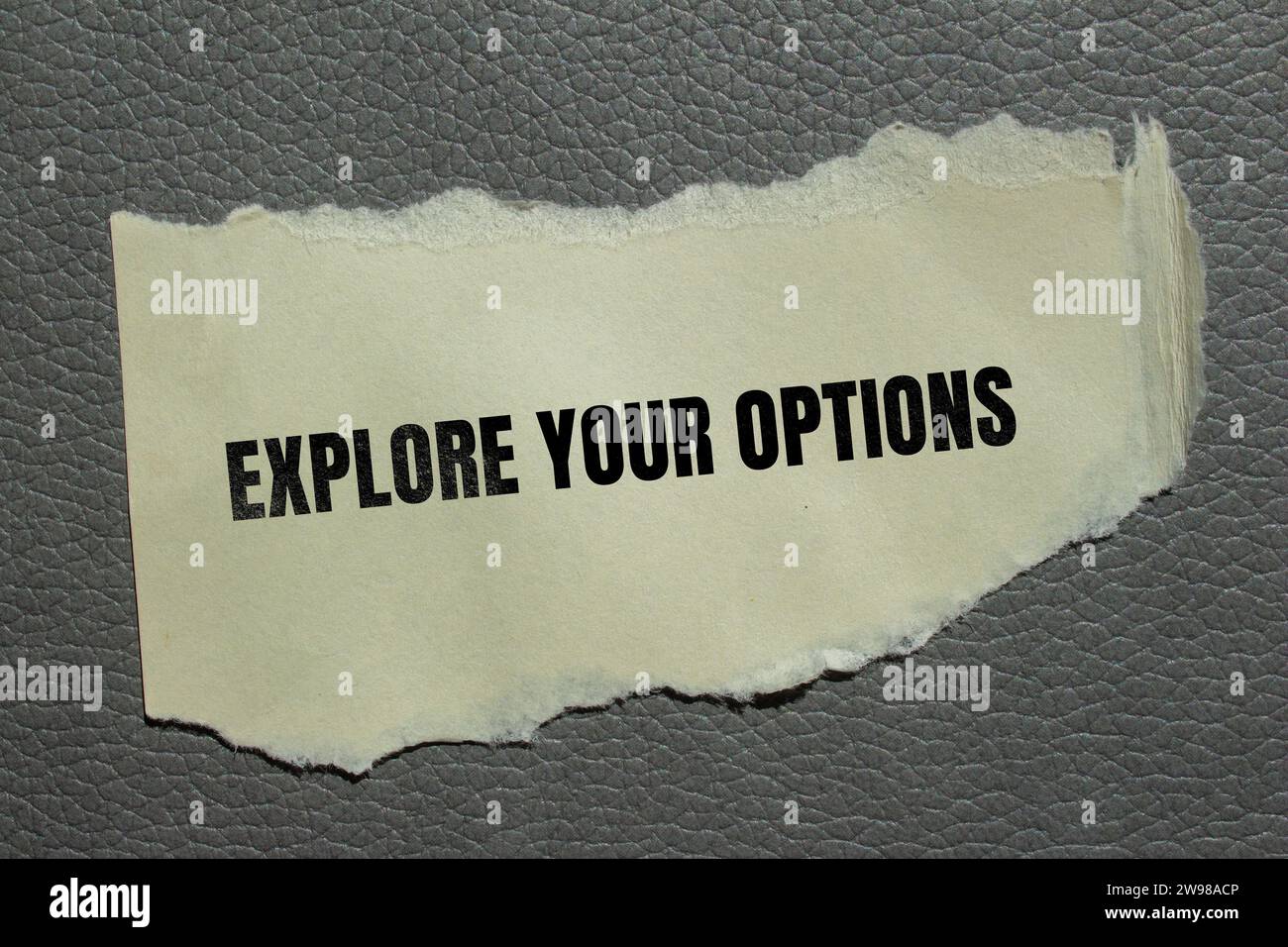 Explore your option lettering on ripped paper. Business concept photo ...