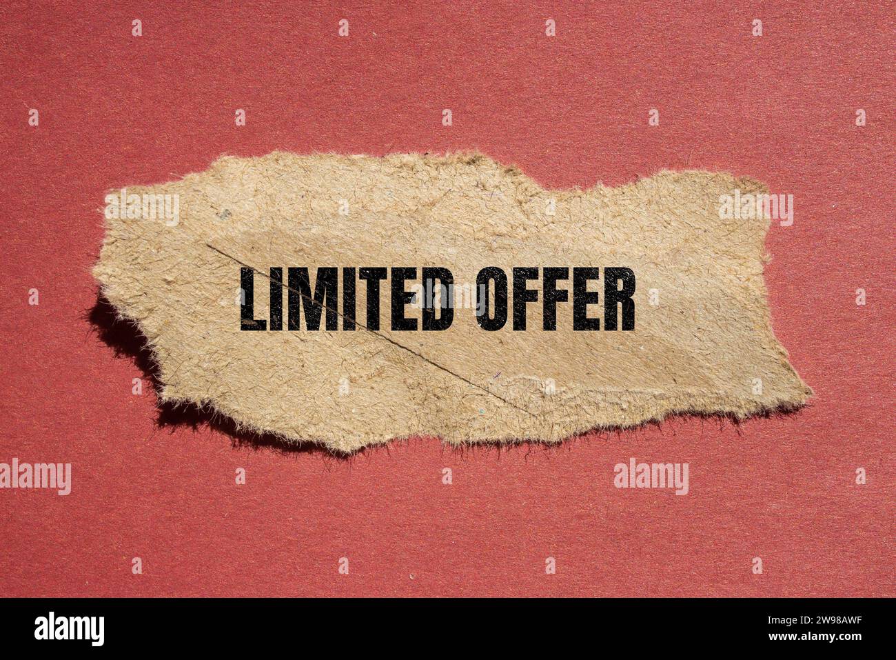Limited offer lettering on ripped paper. Business concept Stock Photo ...