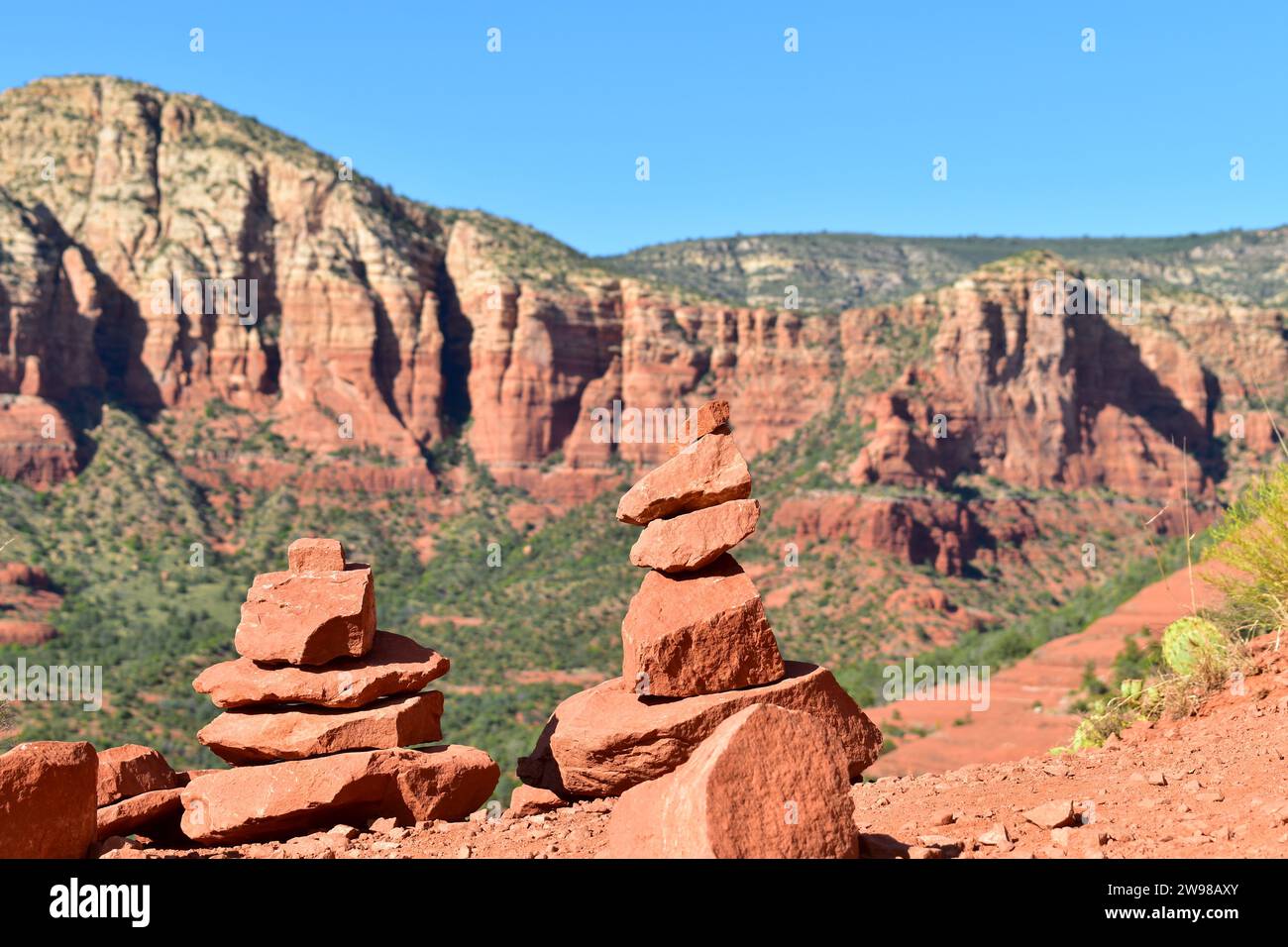 Stone cairns built by hikers on the mountainside of Bell Rock in Sedona ...
