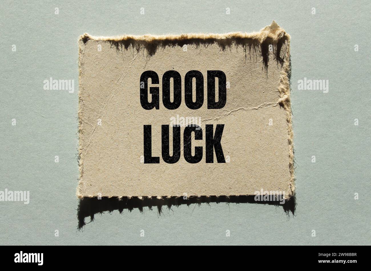 Good luck lettering on ripped paper Stock Photo - Alamy