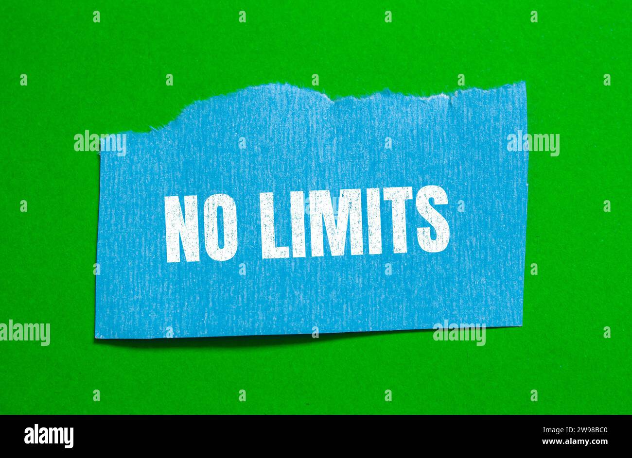 No limits lettering on ripped paper Stock Photo - Alamy