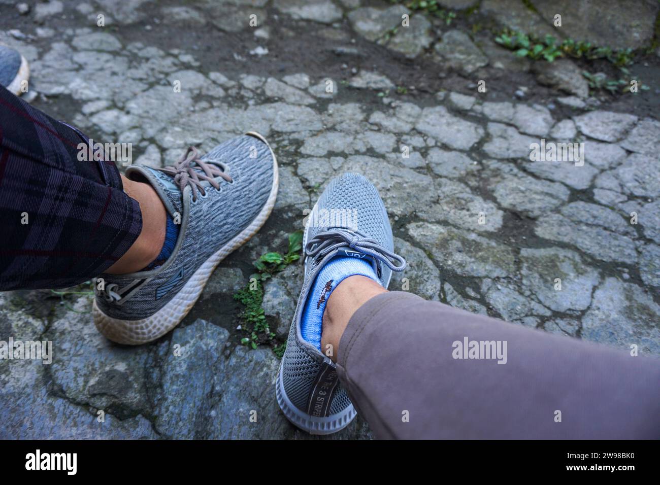 February 23, 2023, two women's feet wearing gray shoes in Wonobosobo ...