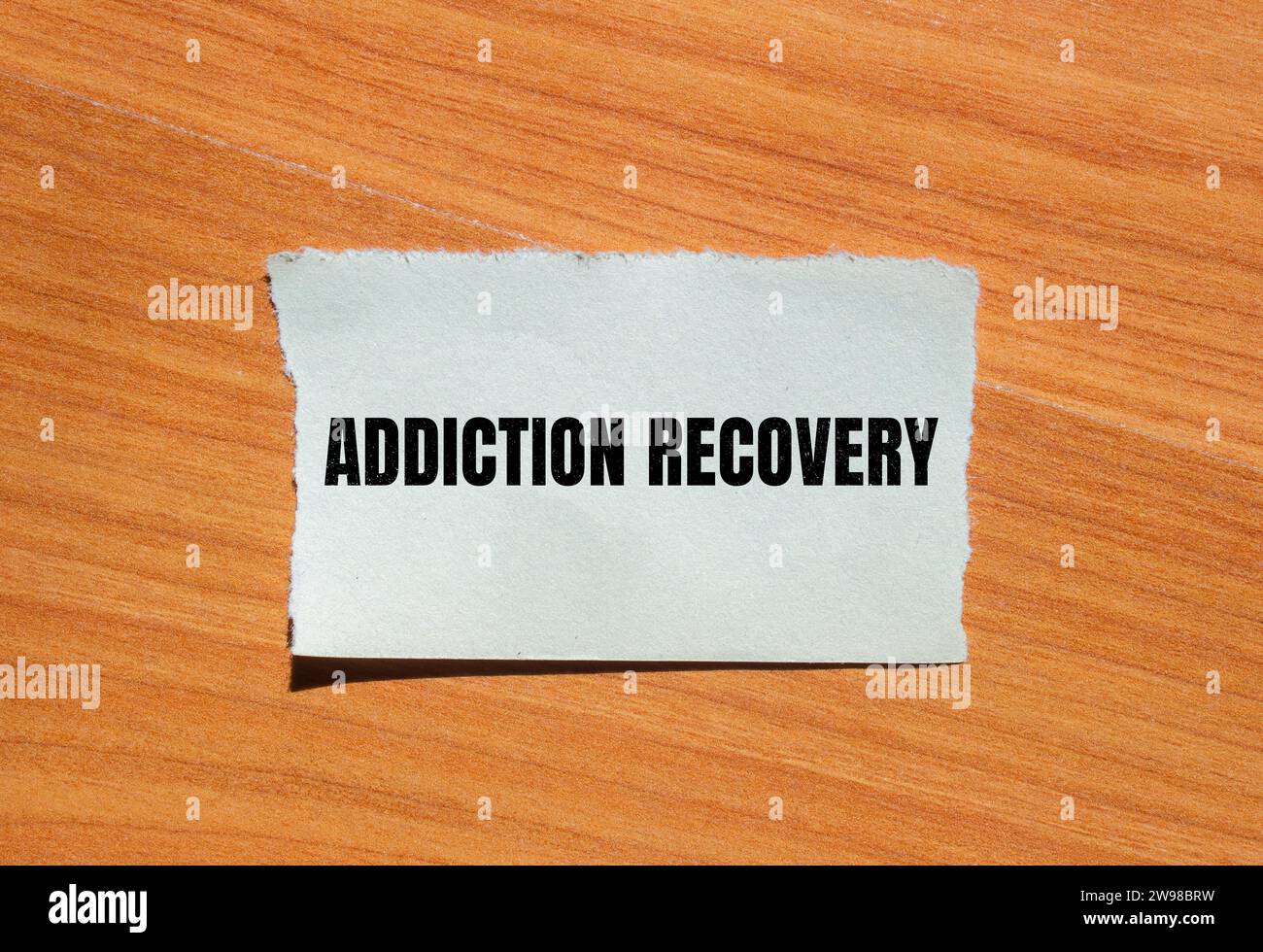 Addiction recovery lettering on ripped paper piece. Conceptual photo ...