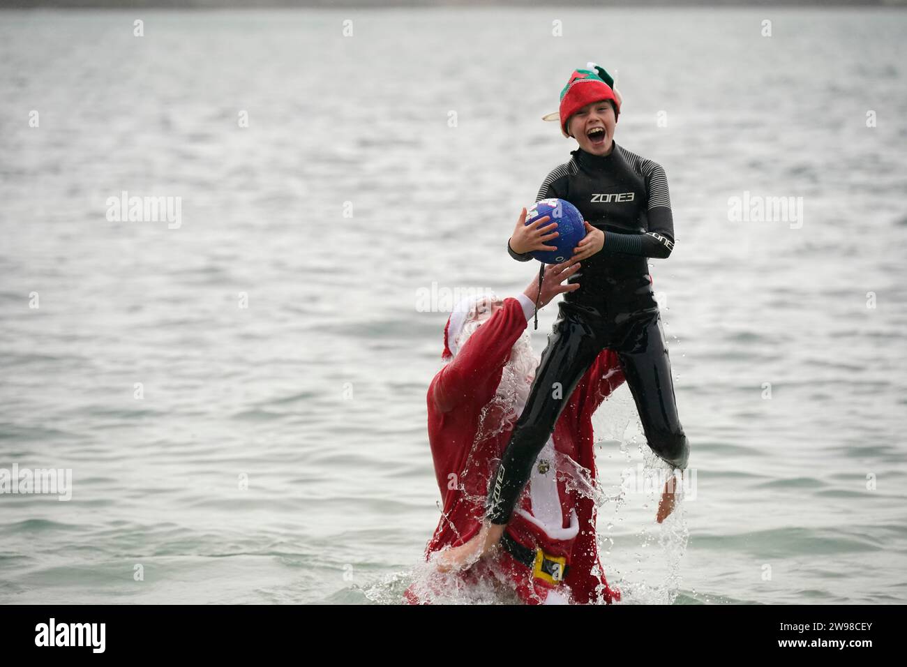 Patrick Corkery dressed as Santa and his son Matthew, 12, dressed as an ...