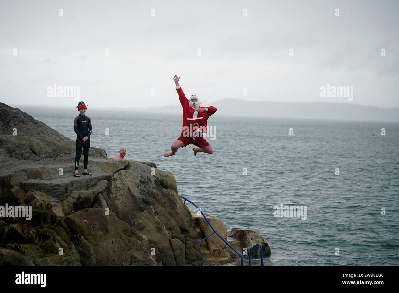 Patrick Corkery dressed as Santa and his son Matthew, 12, dressed as an ...