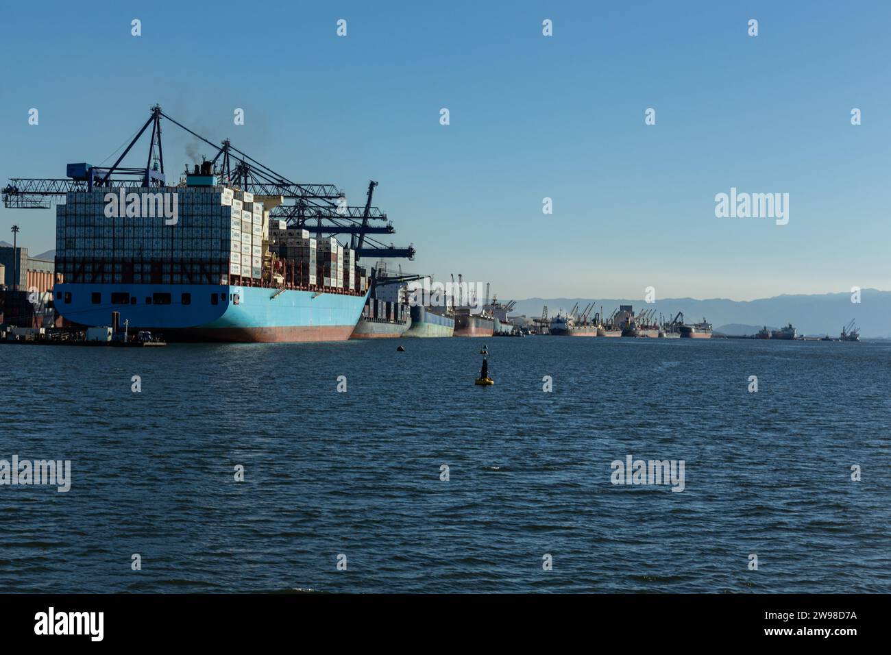 wide view of the port with many cargo ships anchored and loading, from ...