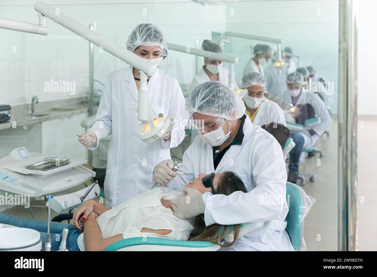 dentistry student in a practical class at college, with the patient ...