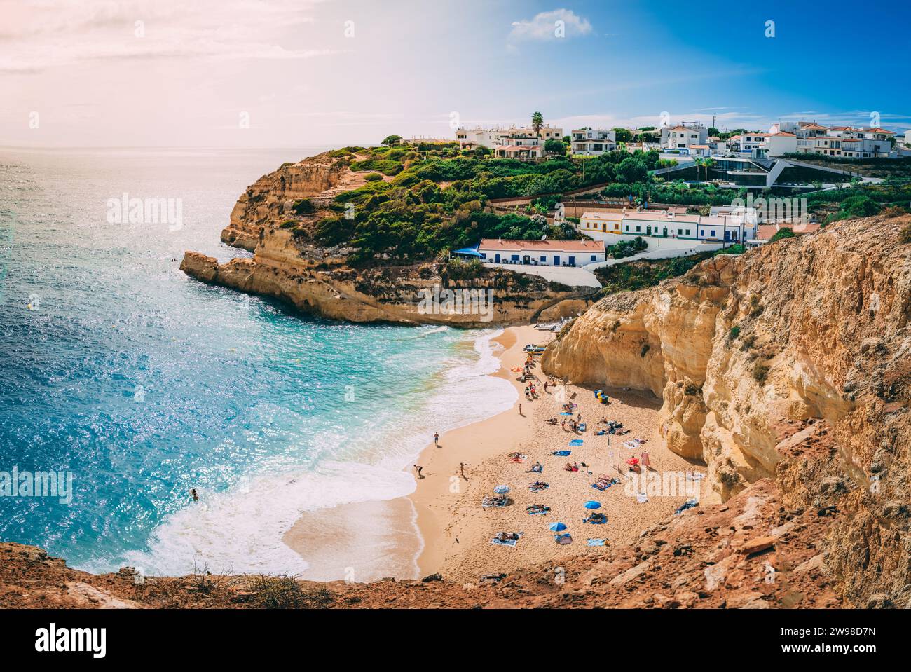 View of beach in Benagil fishing village on coast of Portugal. Praia de ...