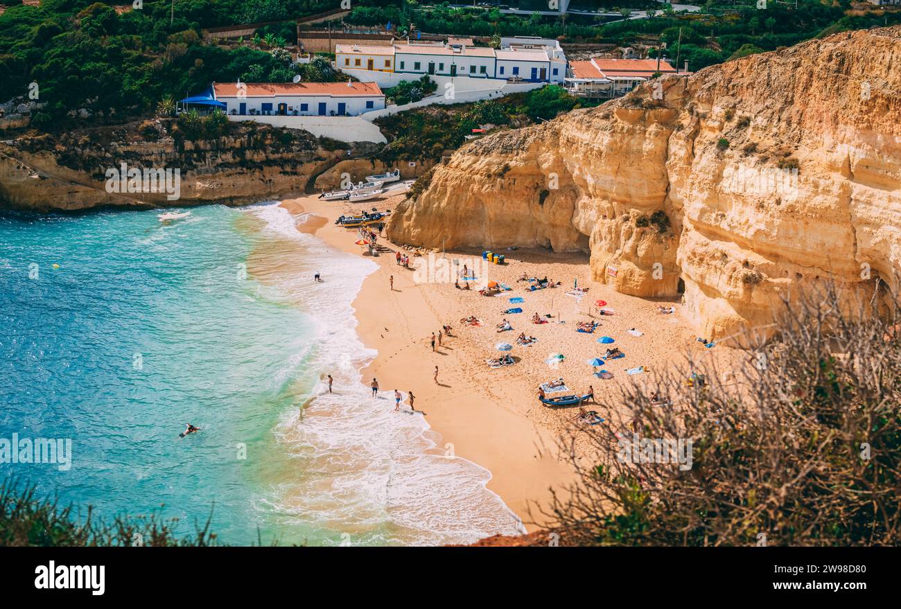 View of beach in Benagil fishing village on coast of Portugal. Praia de ...