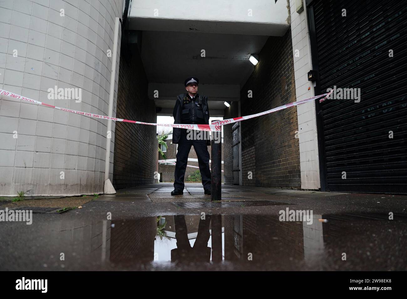 A Metropolitan Police officer at the scene outside Spenlow House in ...