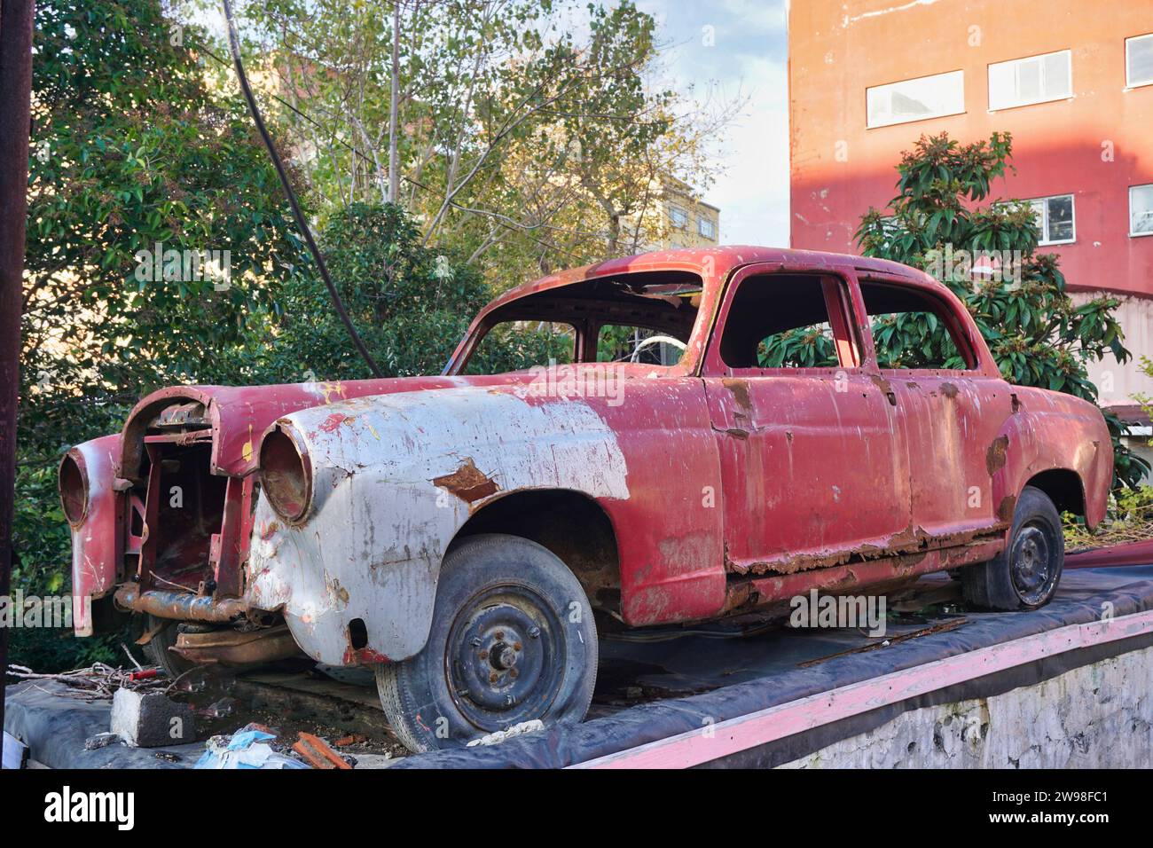 abandoned classic red car, rusty and old car Stock Photo - Alamy