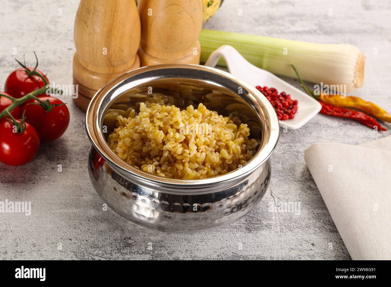 Boiled bulgur wheat in the bowl garnish Stock Photo - Alamy