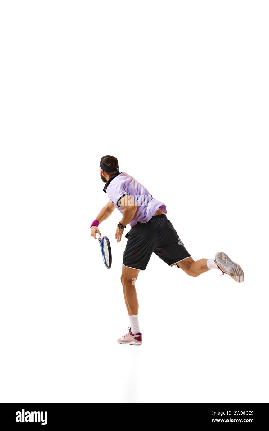 Competitive athletic man, tennis player during game in motion with ...