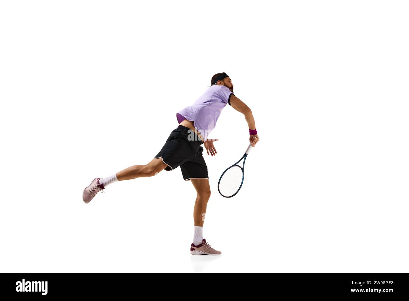 Competitive athletic man, tennis player during game in motion with ...