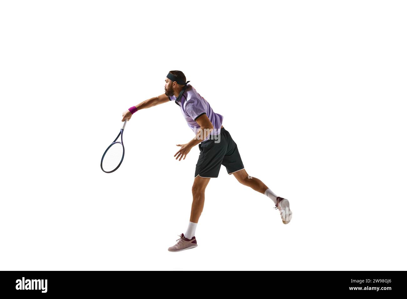 Competitive athletic man, tennis player during game in motion with ...