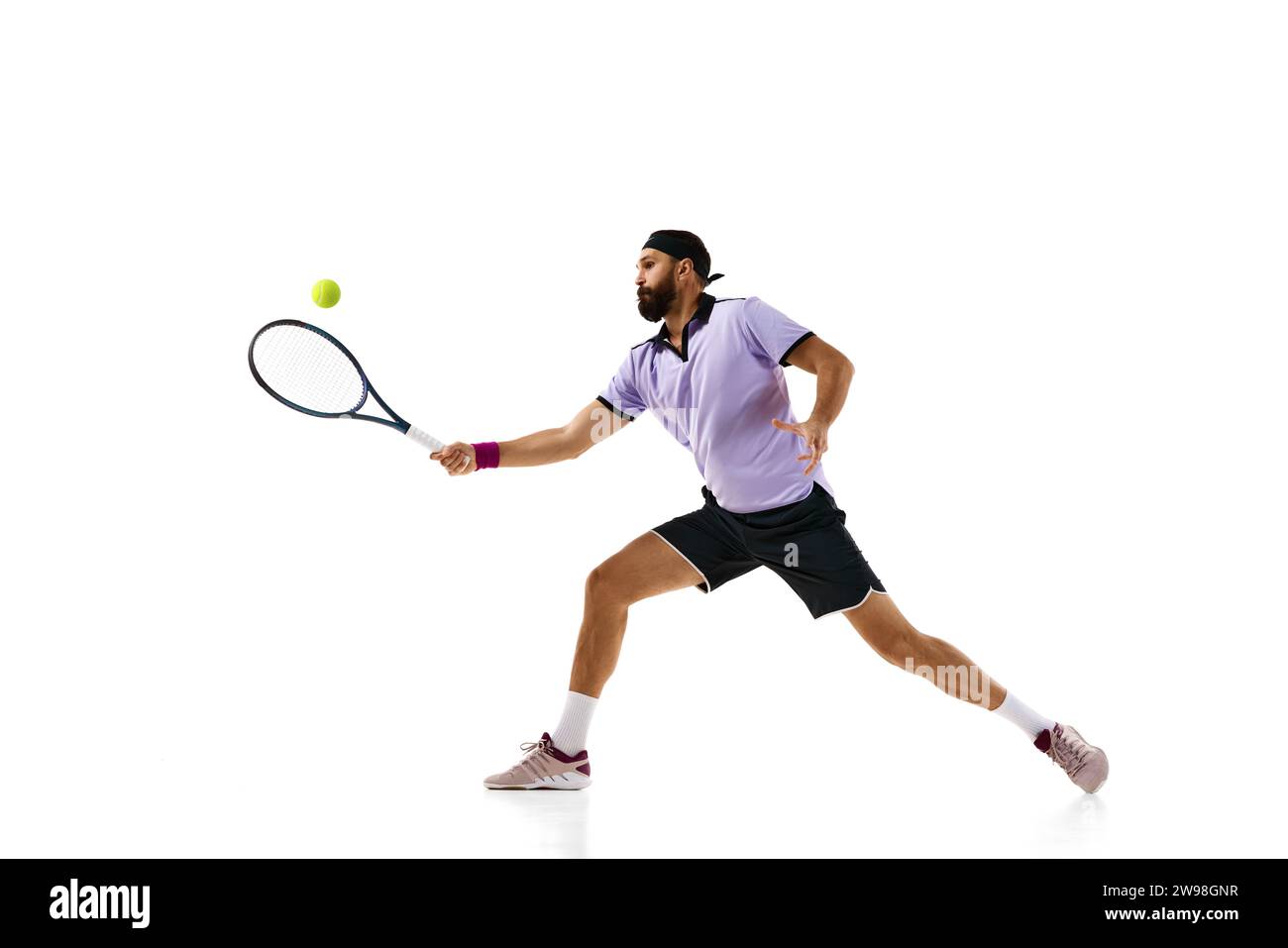 Dynamic image of bearded athletic man, tennis player in motion with ...