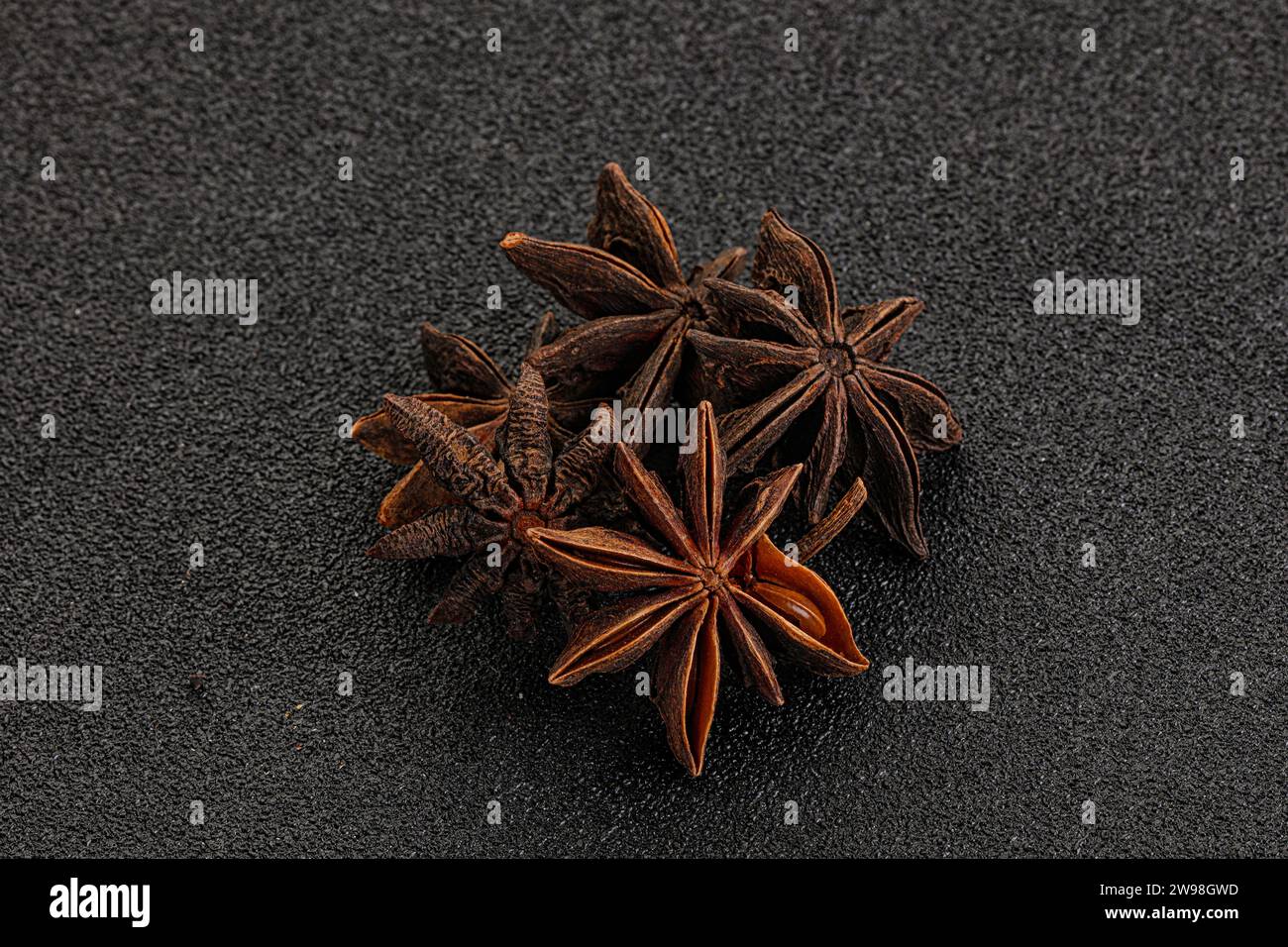 Star anise dry aroma seasoning heap Stock Photo - Alamy