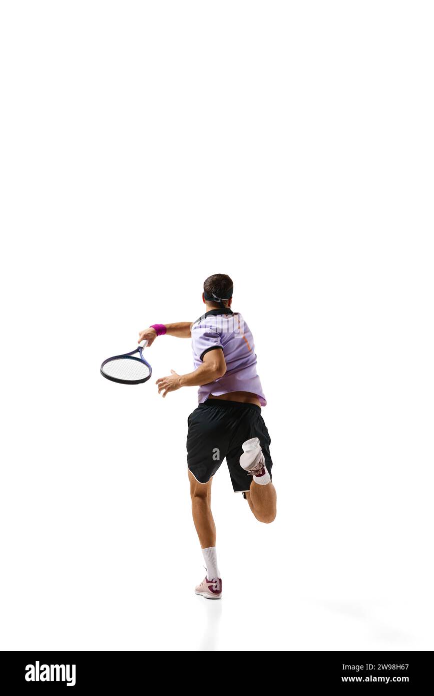 Man, tennis player in motion during game, training, hitting ball with ...