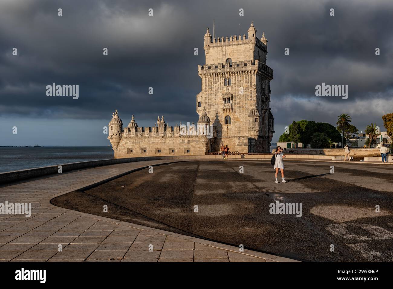 Belem Tower (Torre de Belem) on stormy day from River Tagus waterfront ...
