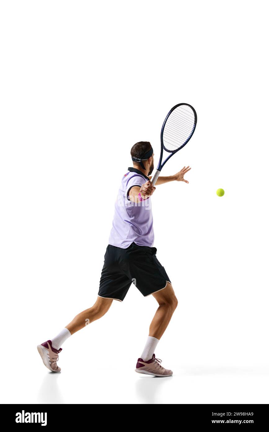 Man, tennis player in motion during game, training, hitting ball with ...