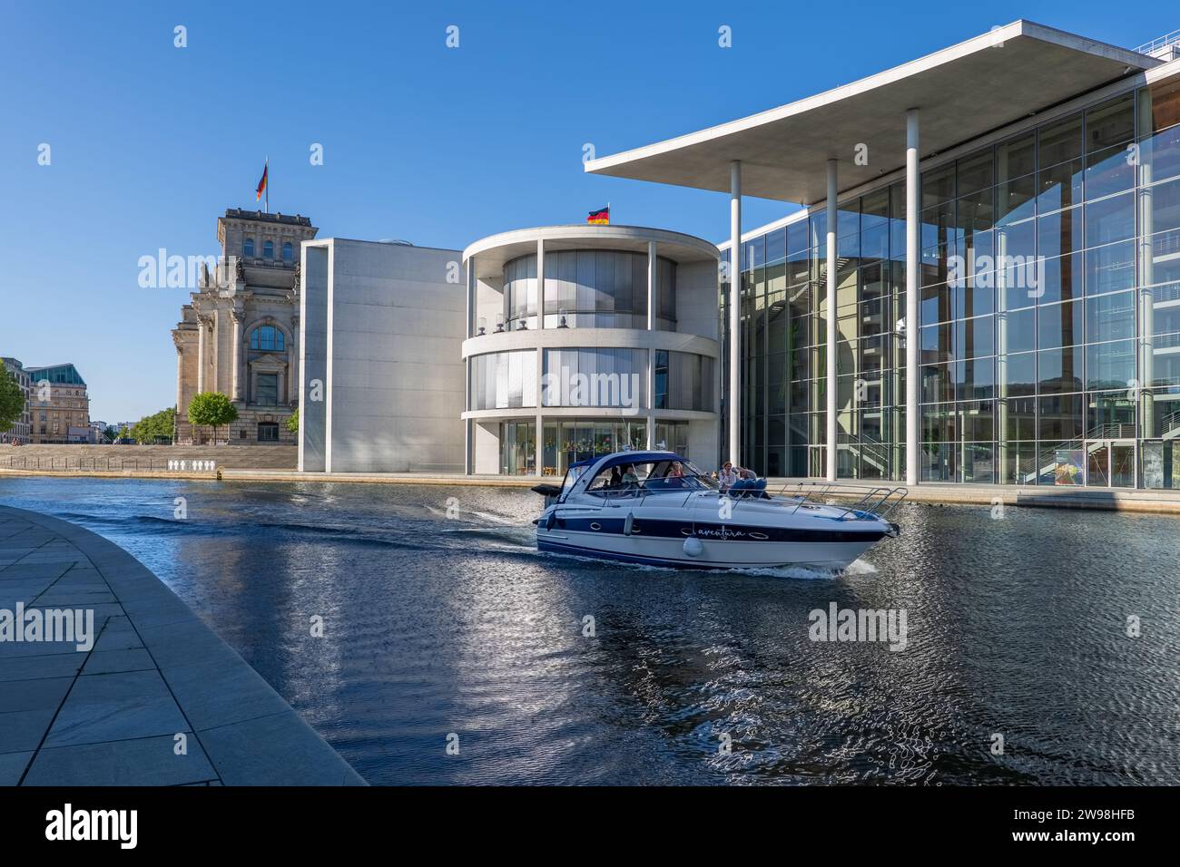 Germany, Berlin, Paul Loebe (Paul-Lobe-Haus) building and motor yacht ...
