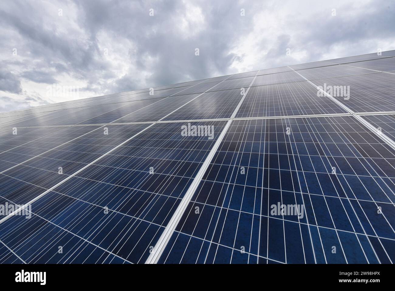Solar panel device in cloudy weather Stock Photo - Alamy