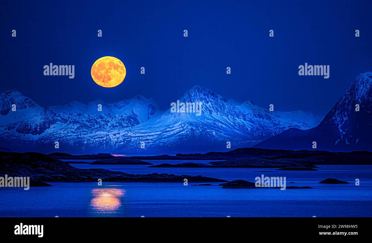 Large supermoon rising behind the majestic mountains of Lofoten ...