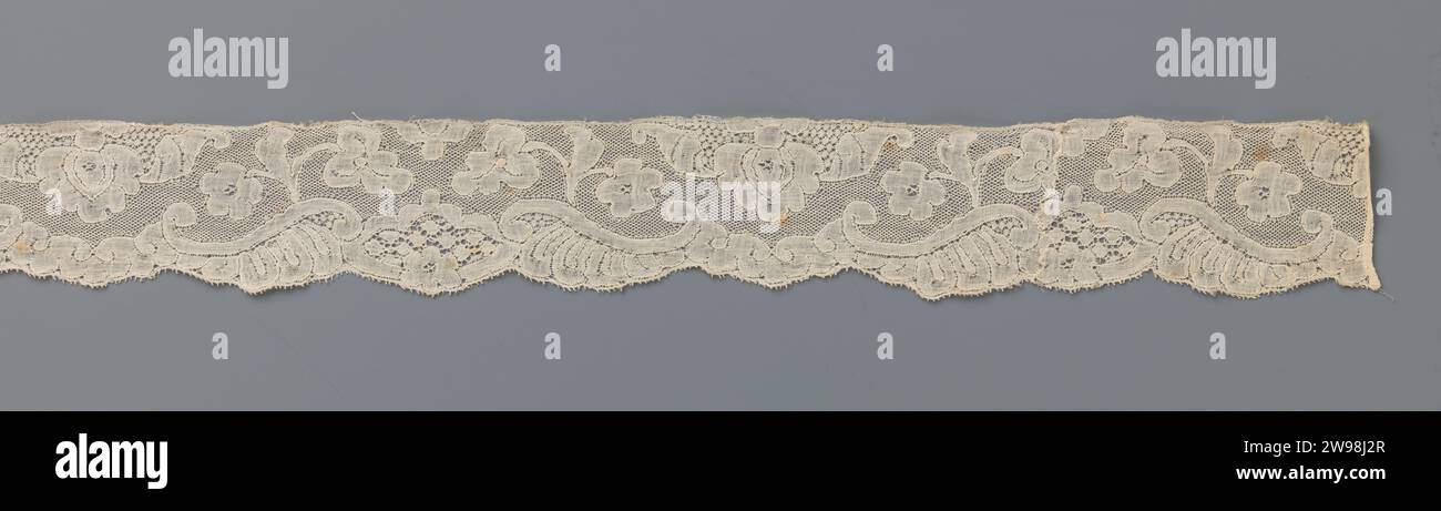 Strip of lace with three -lobe cartouche and hanging flour with drop ...