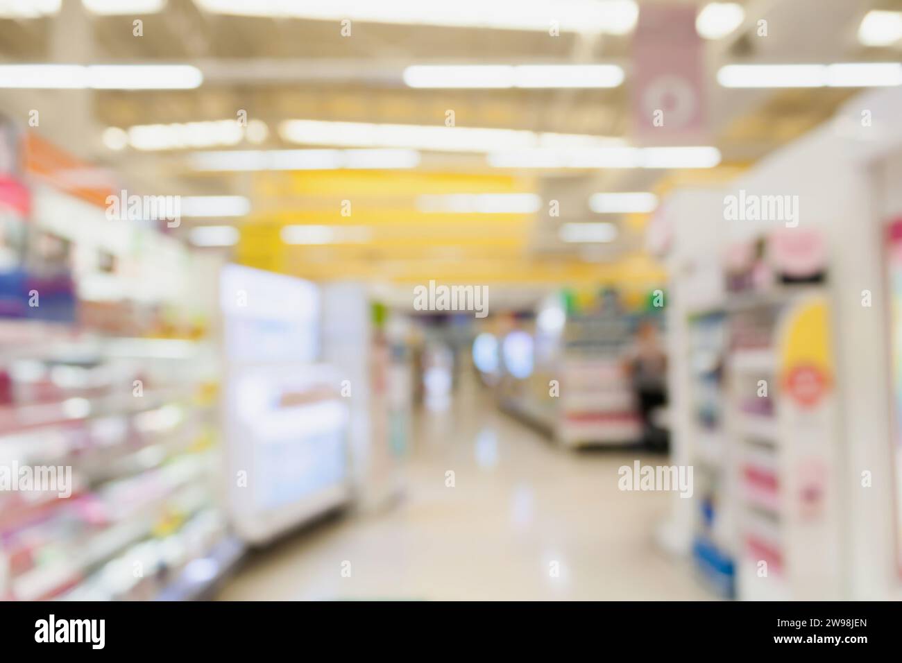 Supermarket shelves store blurred background Stock Photo - Alamy