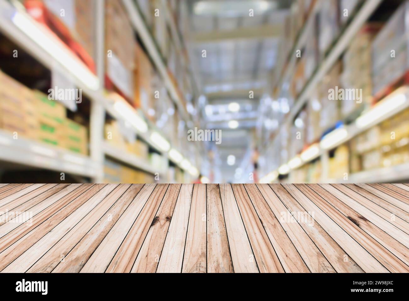 wood table with Rows of shelves with boxes in modern warehouse interior ...