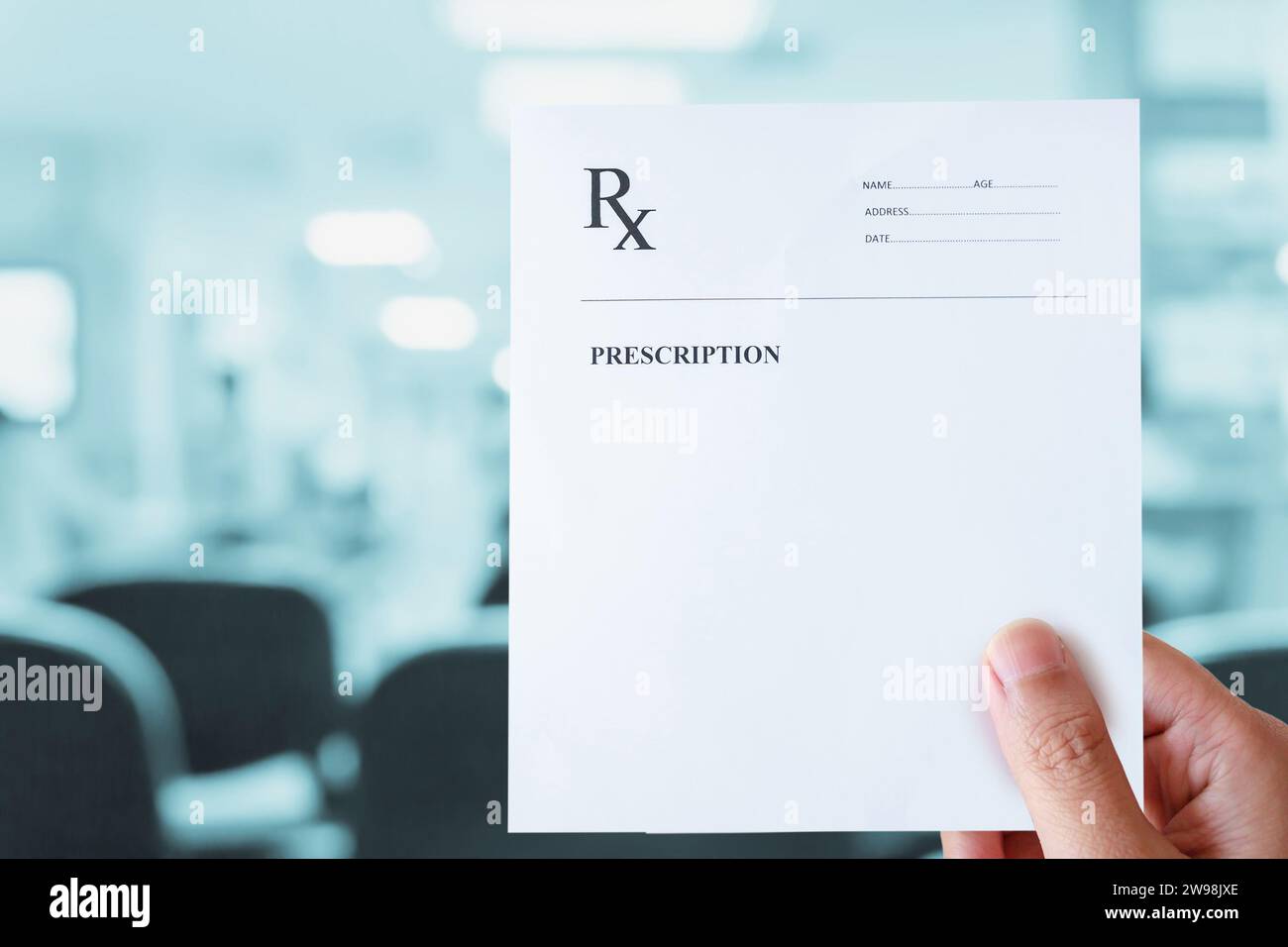 hand hold prescription paper with hospital background Stock Photo - Alamy