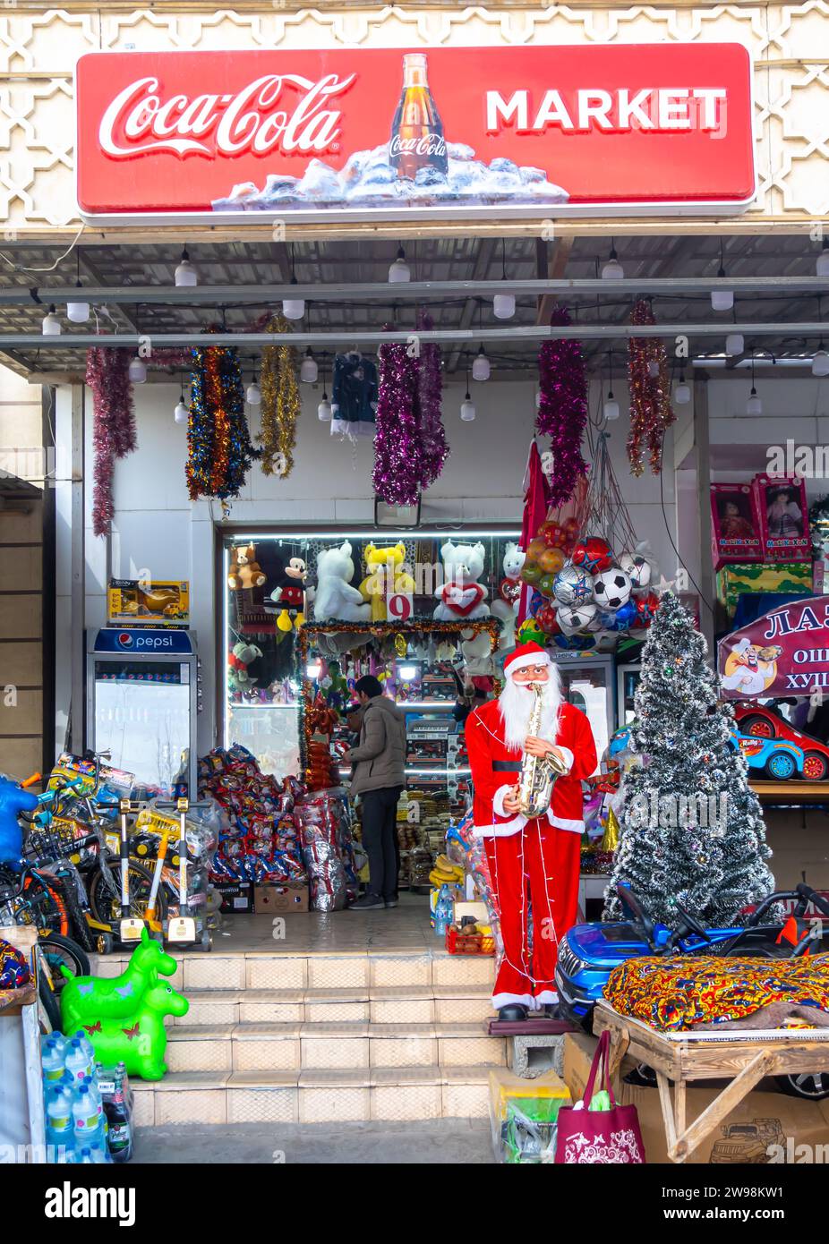 Coca-Cola and Santa Christmas decor on a retail store in Smarkand ...