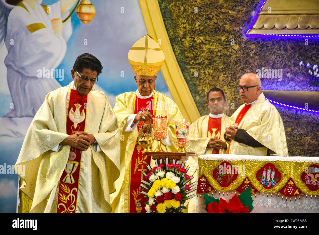 GUWAHATI,INDIA- DECEMBER 25: Priest leads a ritual prayer during a ...