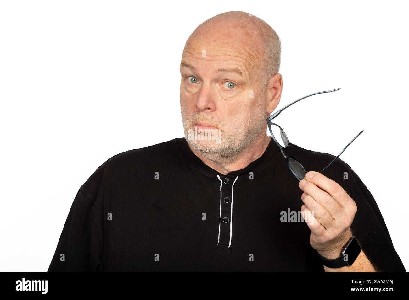 Surprised Middle-Aged Caucasian Man Holding Dark Eyeglasses Frame on ...