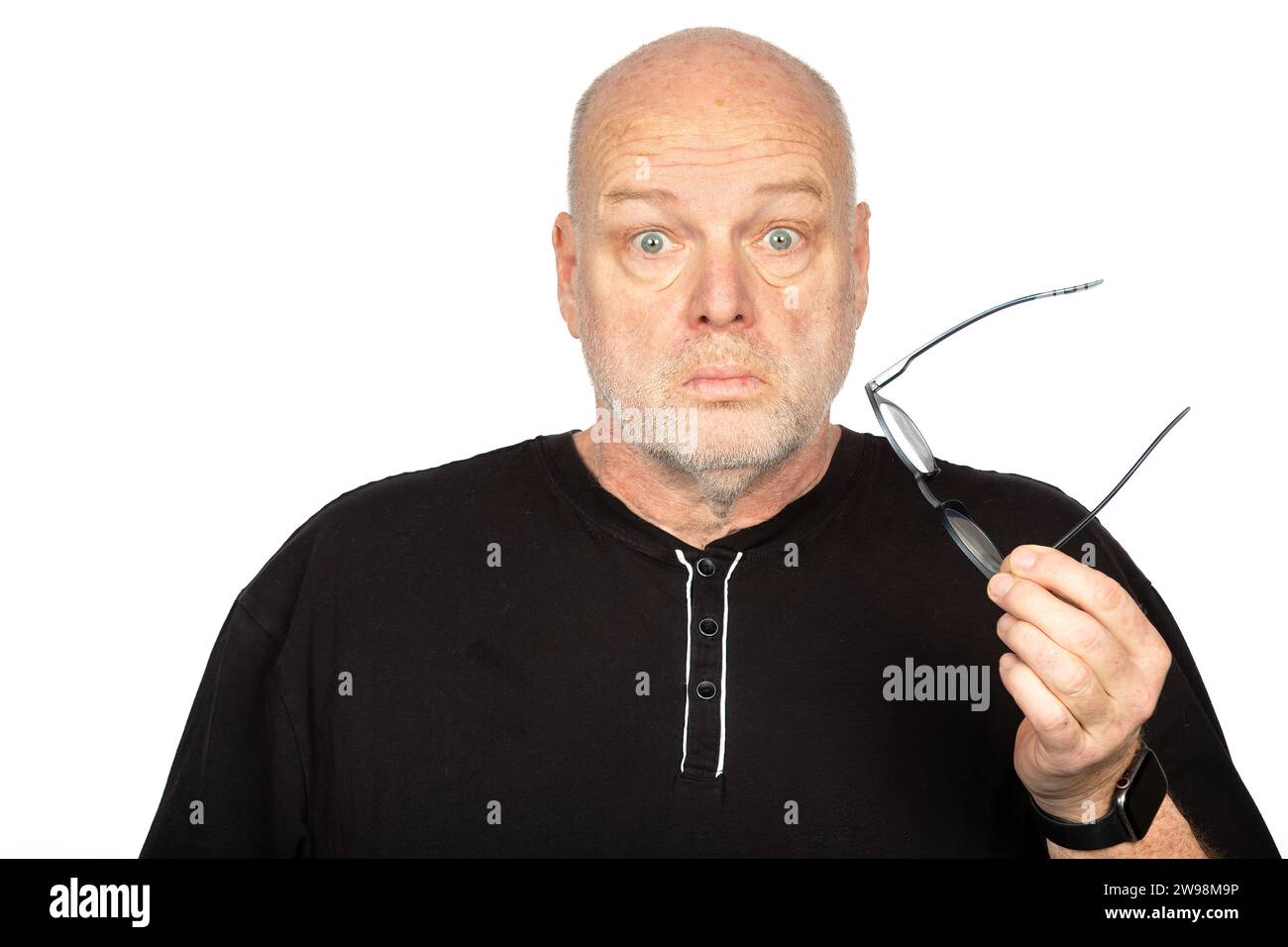 Surprised Middle-Aged Caucasian Man Holding Dark Eyeglasses Frame on ...