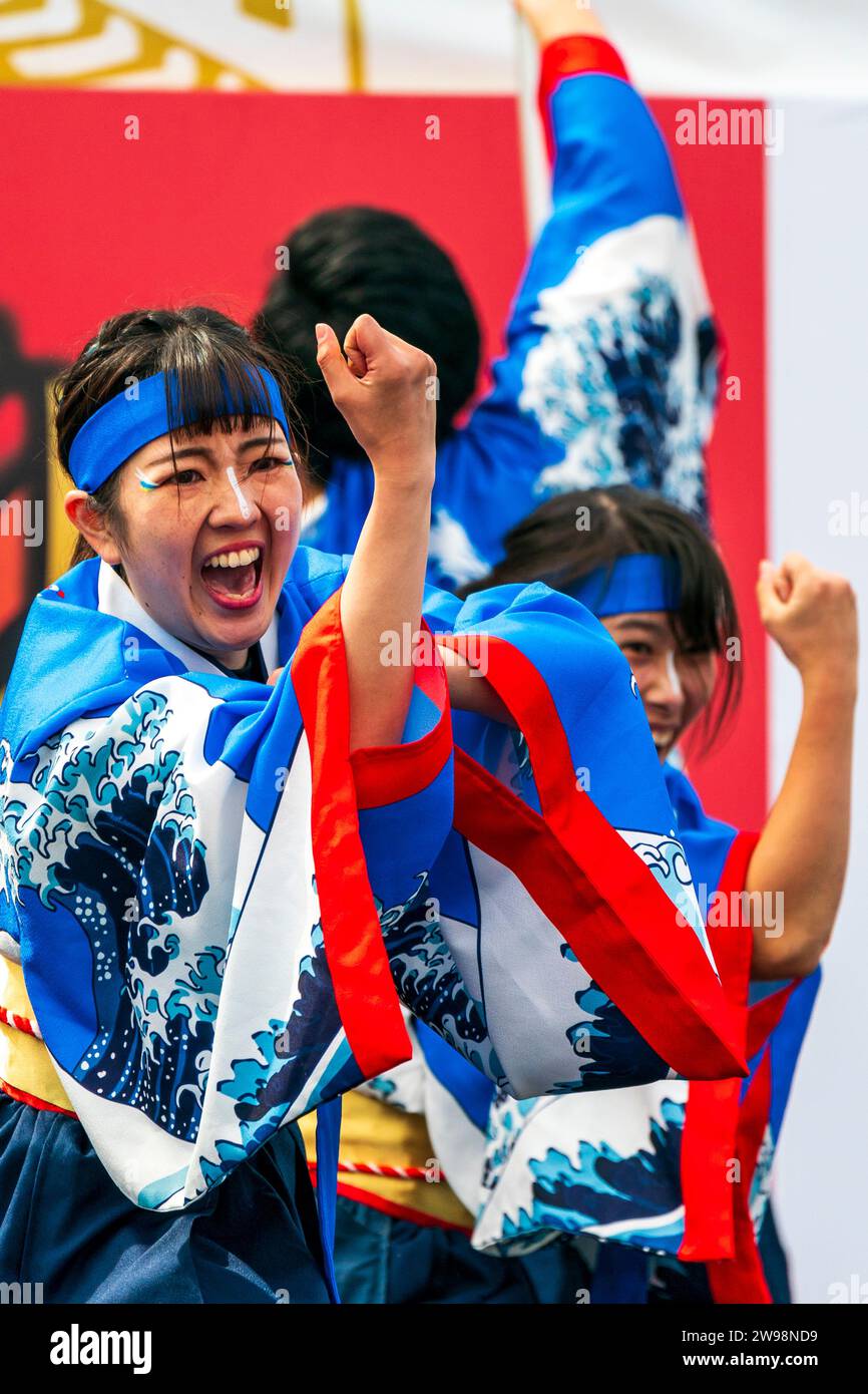 Close up, young Japanese man yosakoi dancer dancing with arm raised ...