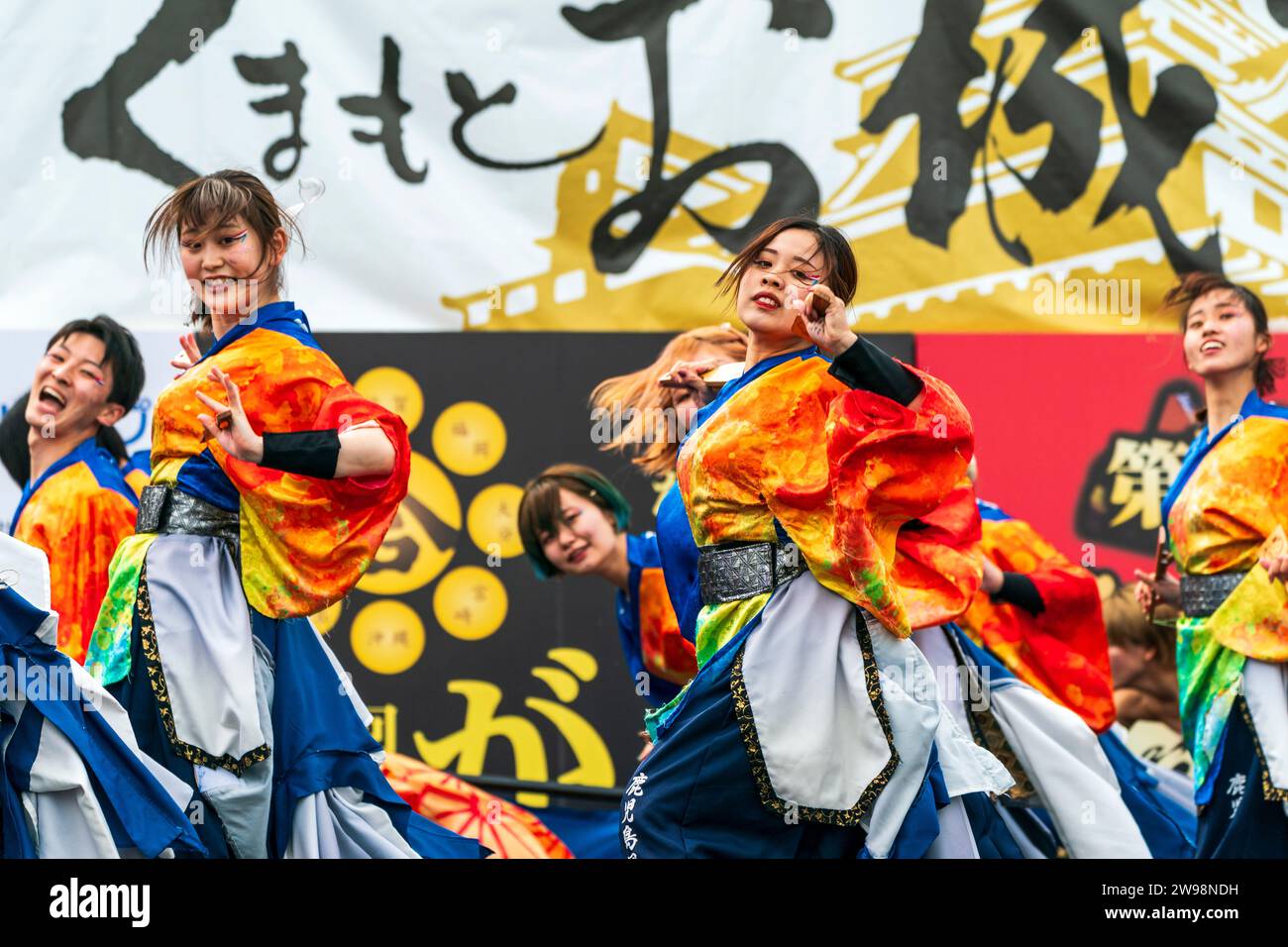 Japanese women yosakoi dancers on stage dancing in colorful yukata ...