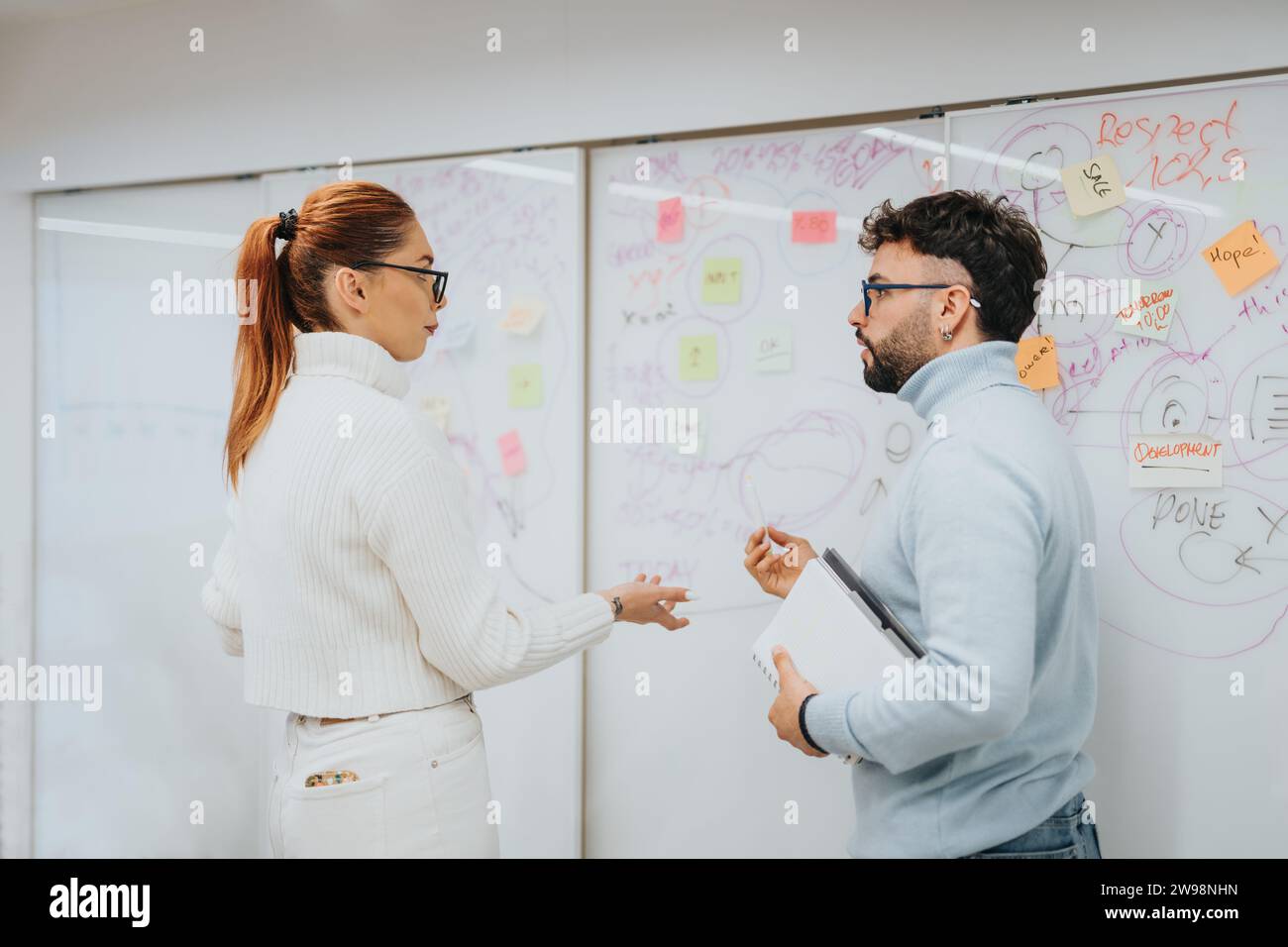 Collaborative brainstorming session in a corporate office with business ...