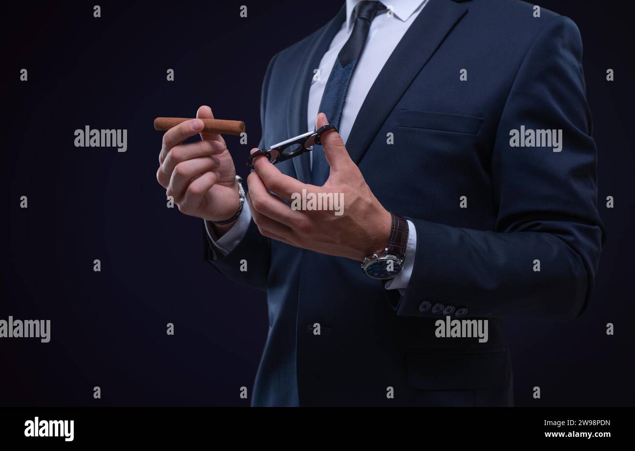 Image of an adult stylish man in a suit with a cigar. Cigar clubs ...