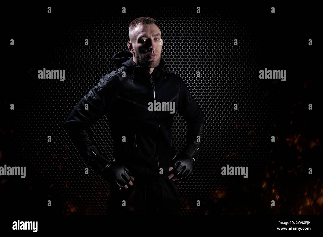 Mixed Martial Arts fighter posing on a metal grid background. Concept ...