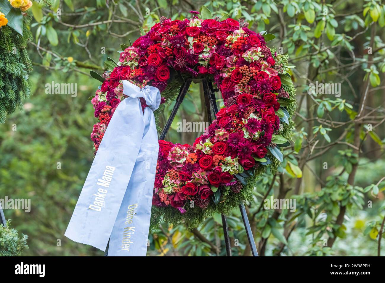 Funeral wreath with flowers at a grave, Germany Stock Photo - Alamy