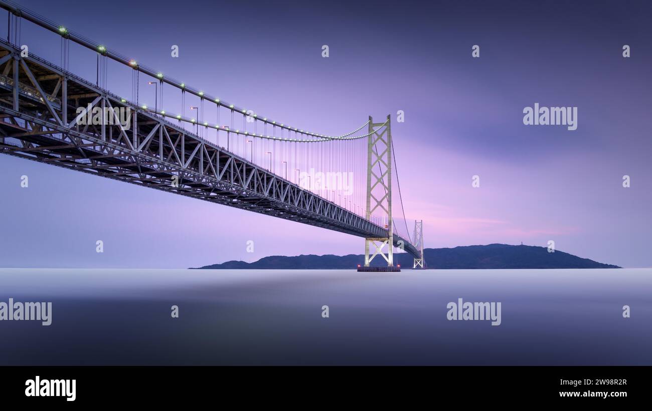 Long exposure of a colourful dusk at the illuminated Akashi Kaikyo ...