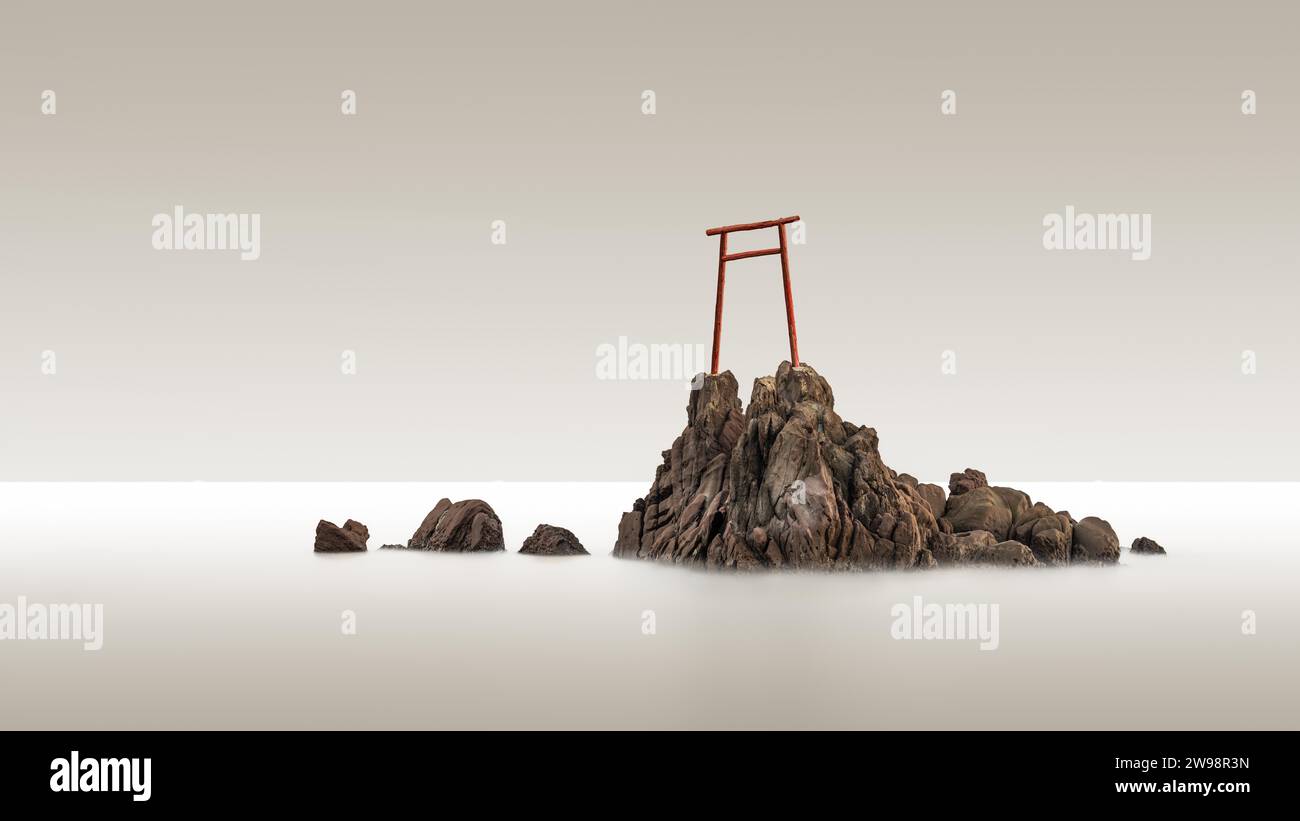 Minimalist long exposure of an old, simple wooden torii on the Pacific ...