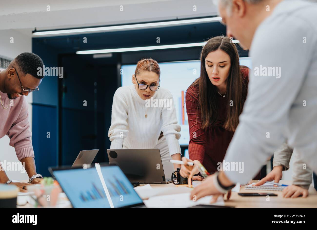 Business team focused on project management and sales, they share ideas ...