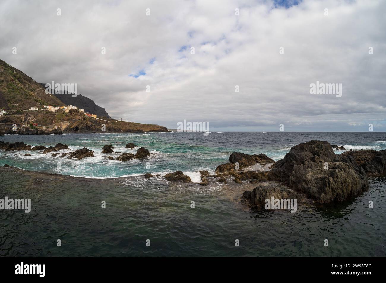 The rocky shore and natural pools of El Caleton. Garachico. Tenerife ...