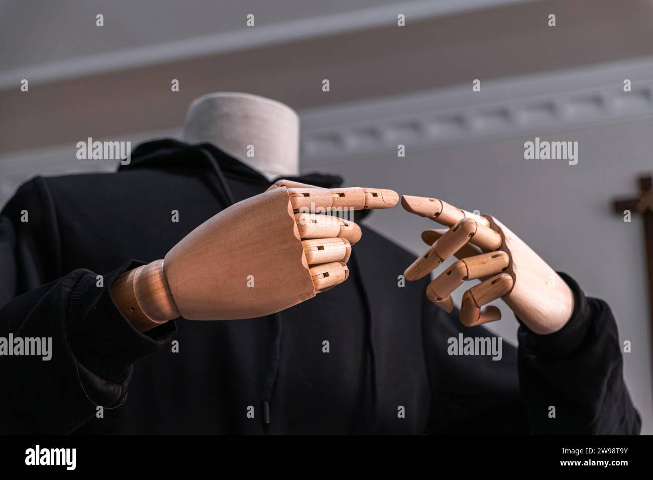 Wooden hand posting poiting sign isolated with headless body. Gesture fingers. Forefingers ...