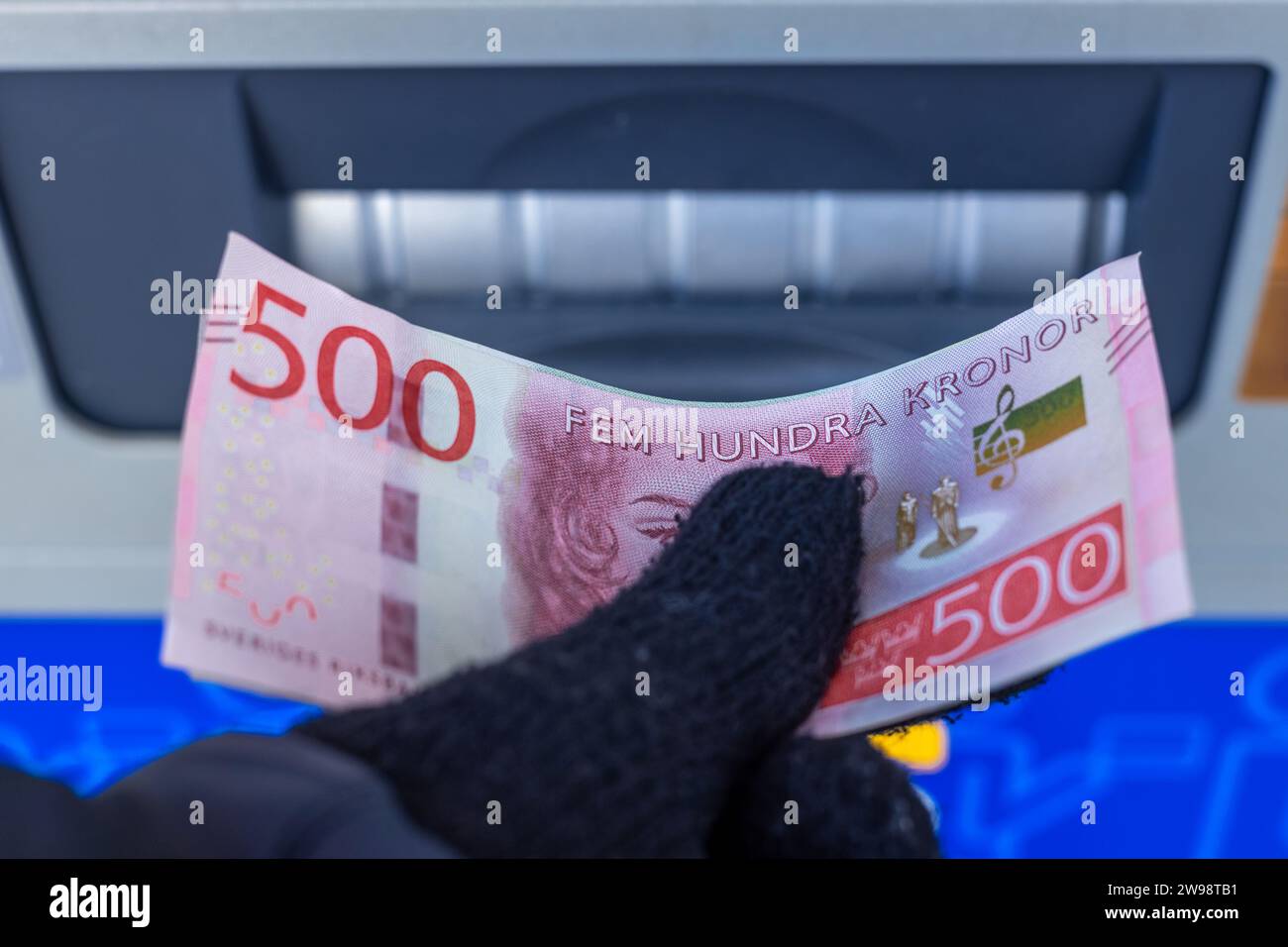 Woman holding swedish krona hi-res stock photography and images - Alamy