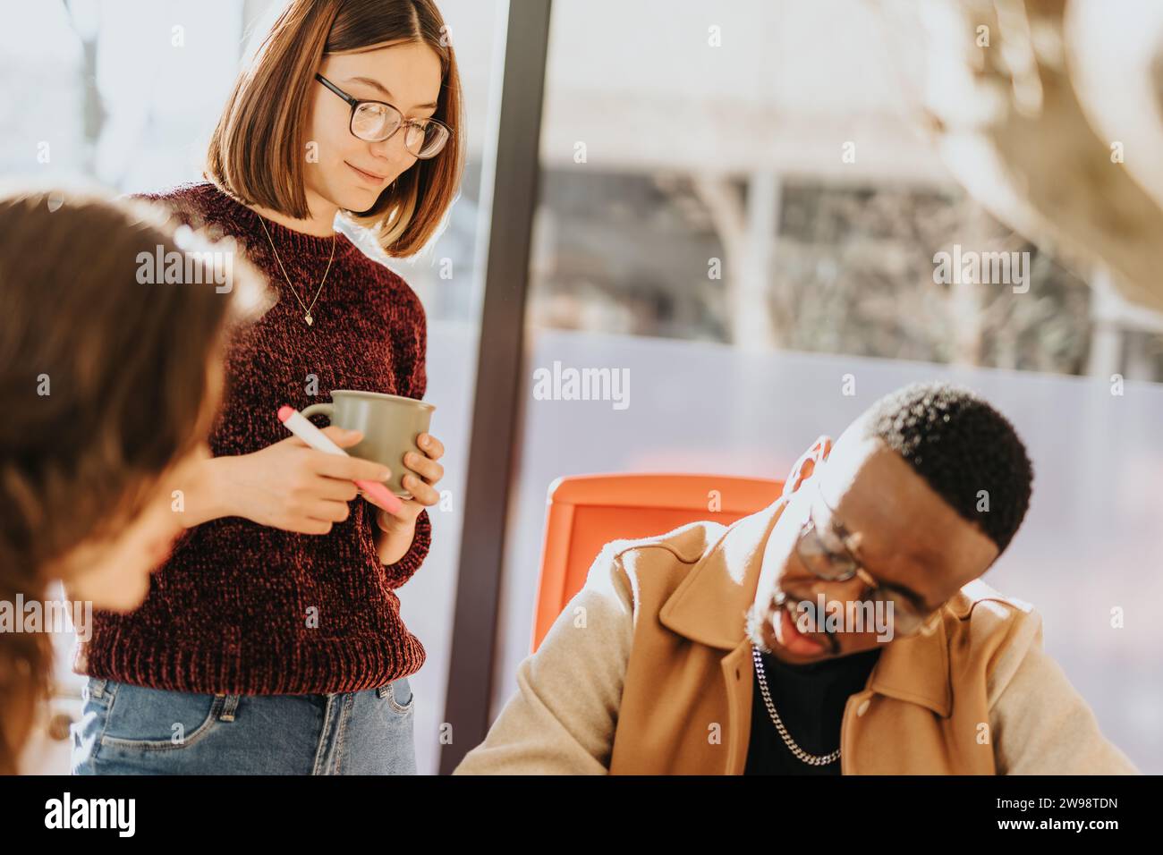 Business team collaborating, discussing ideas in a modern office ...