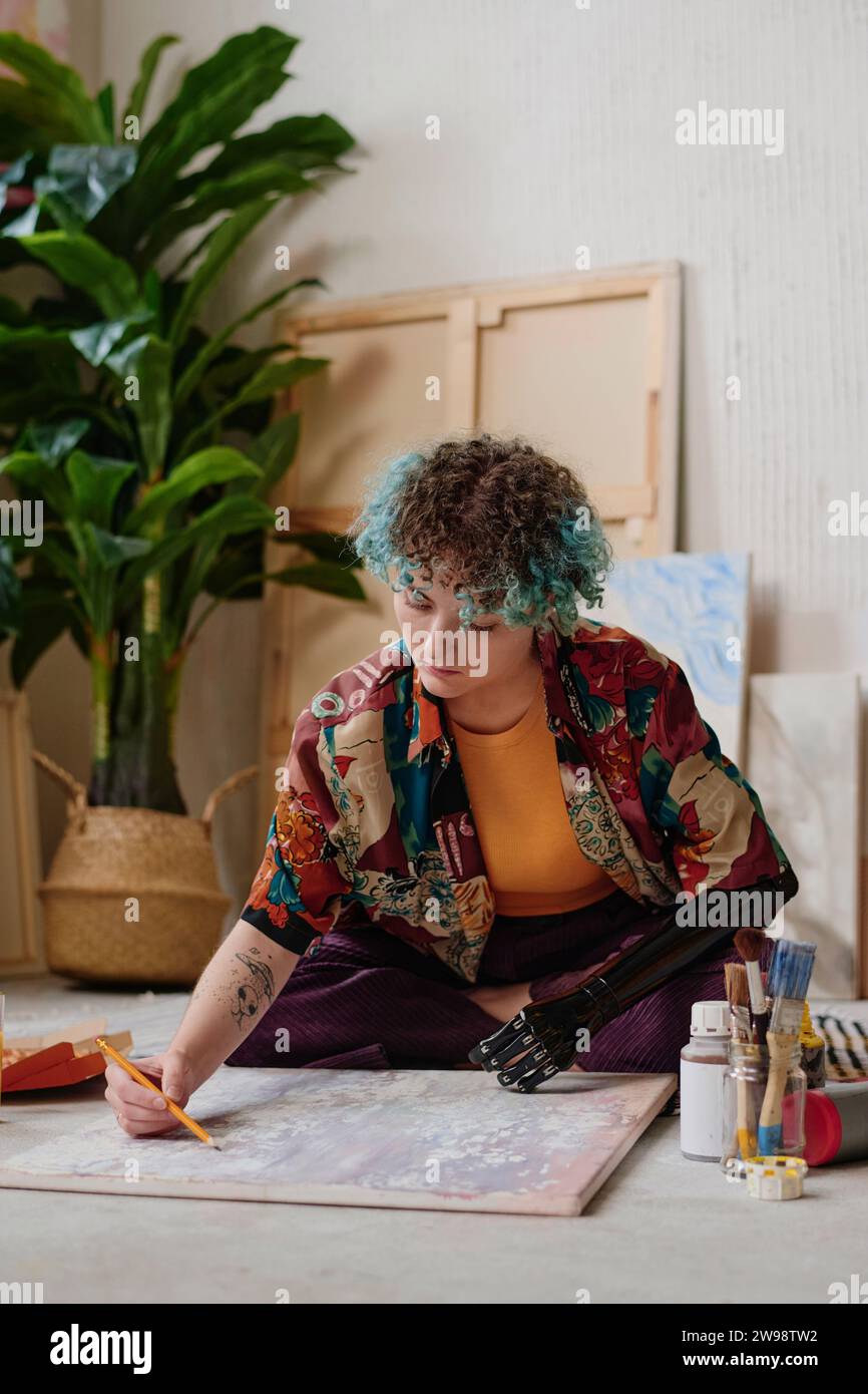 Young woman with person with disability drawing sketch on canvas Stock ...