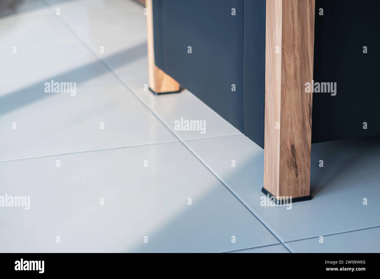 Modern furniture, wooden legs, Tile floor. Office detail, business ...